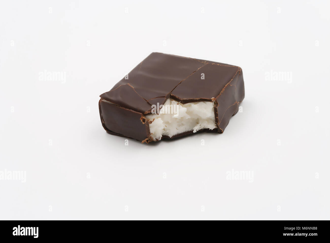 Snack chocolate candy with white stuffing. On a white background Stock ...