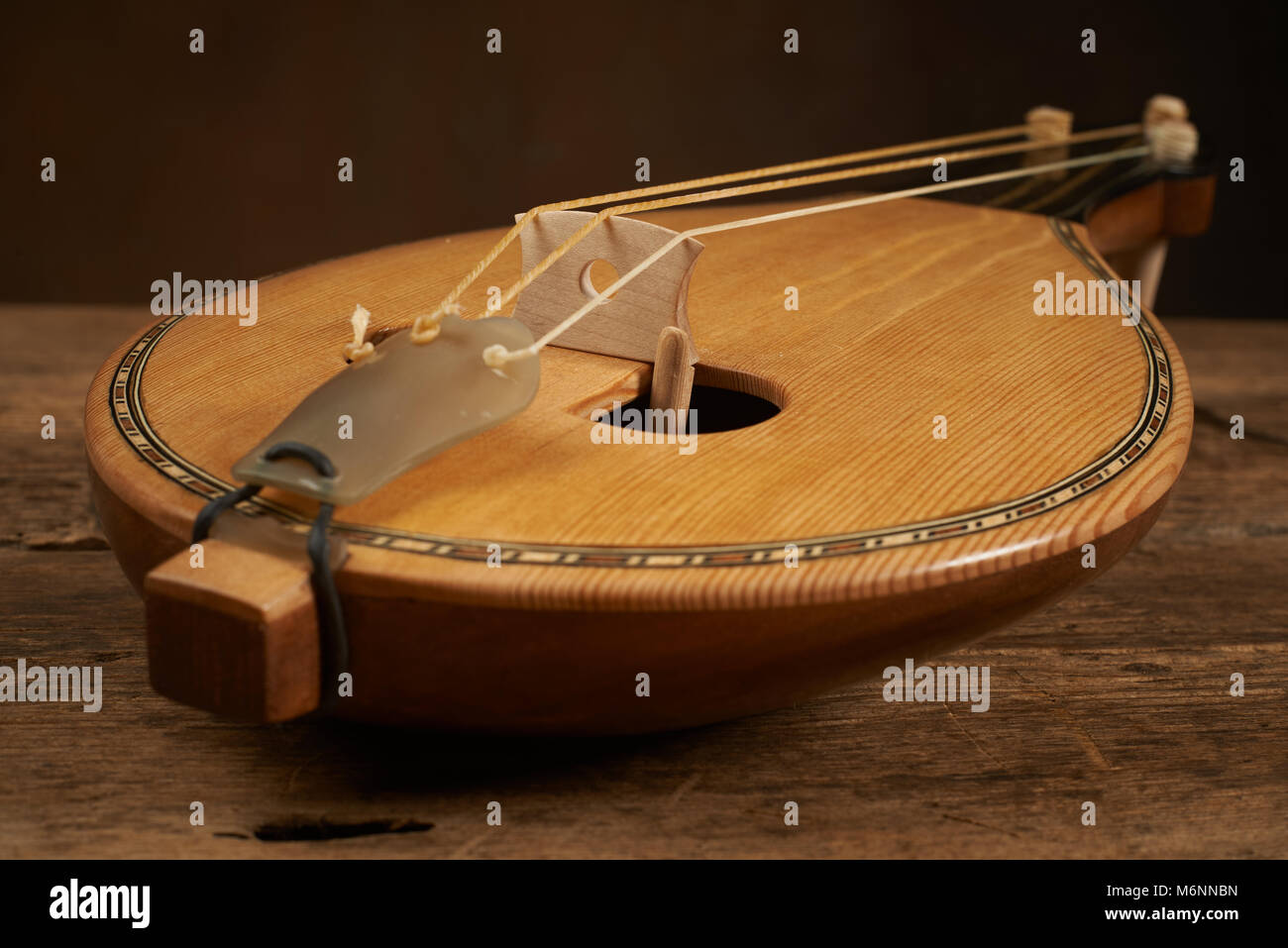 Traditional Greek instrument called Thrakian lyra on wooden background ...