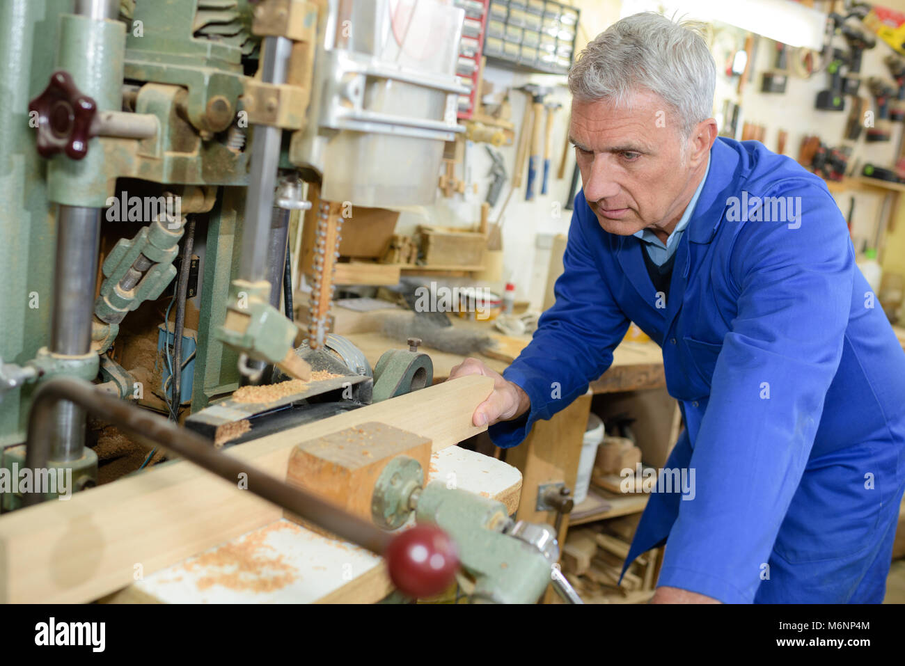 Senior worker using tools hi-res stock photography and images - Alamy