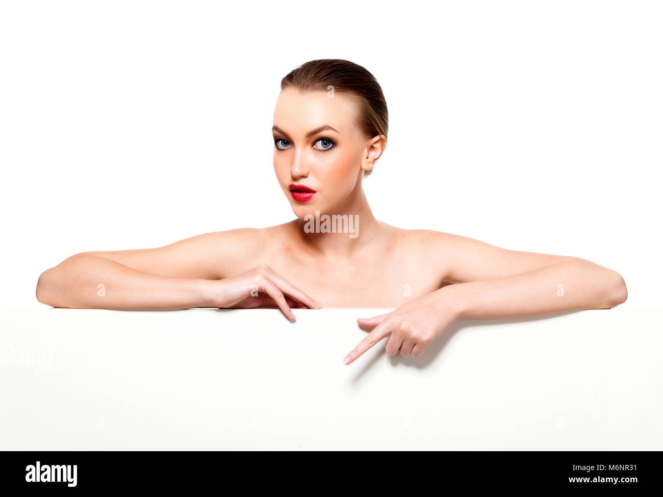 Beautiful young woman presenting something, isolated on white ...