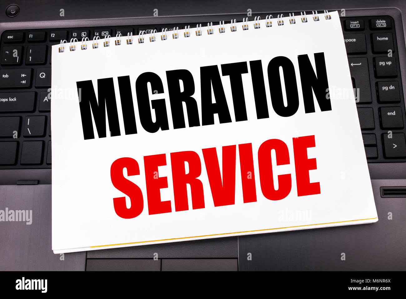 Handwritten text showing Migration Service. Business concept writing ...
