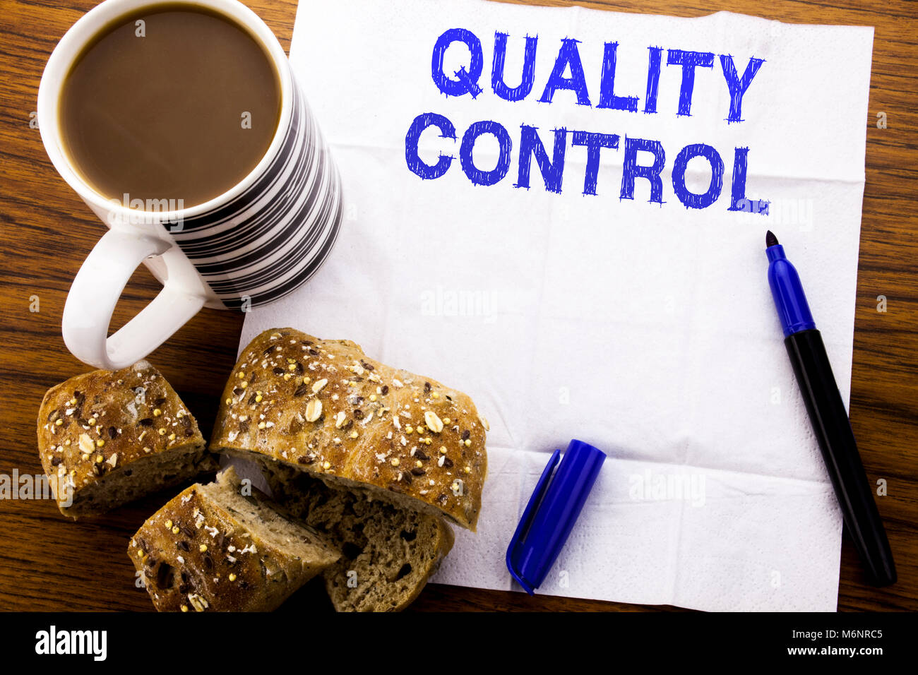 Handwritten text showing Quality Control. Business concept for ...