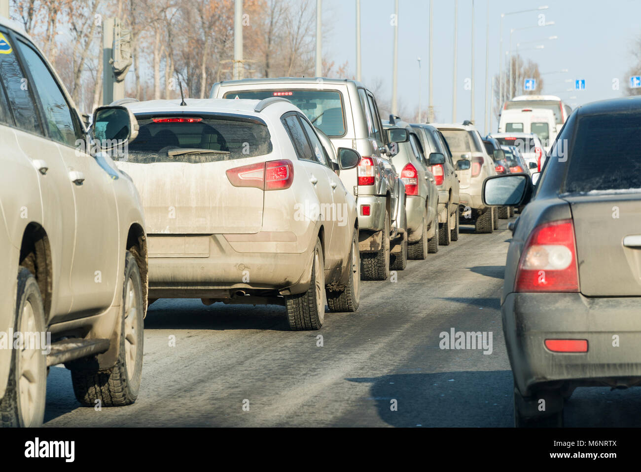 Cars standing in a traffic jam on city street Stock Photo - Alamy