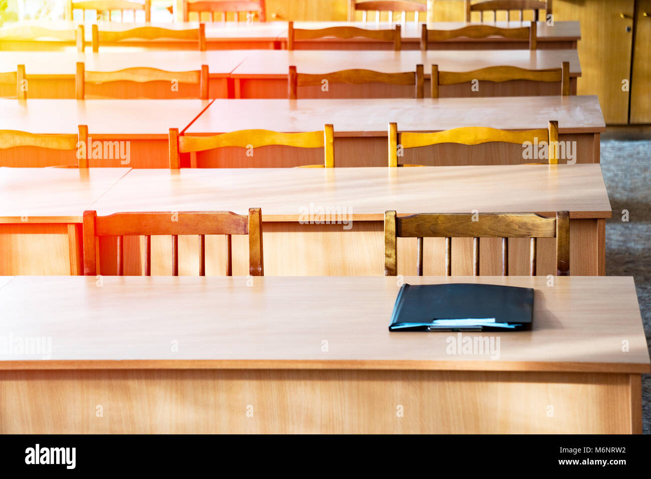 Empty tables in the classroom Stock Photo - Alamy