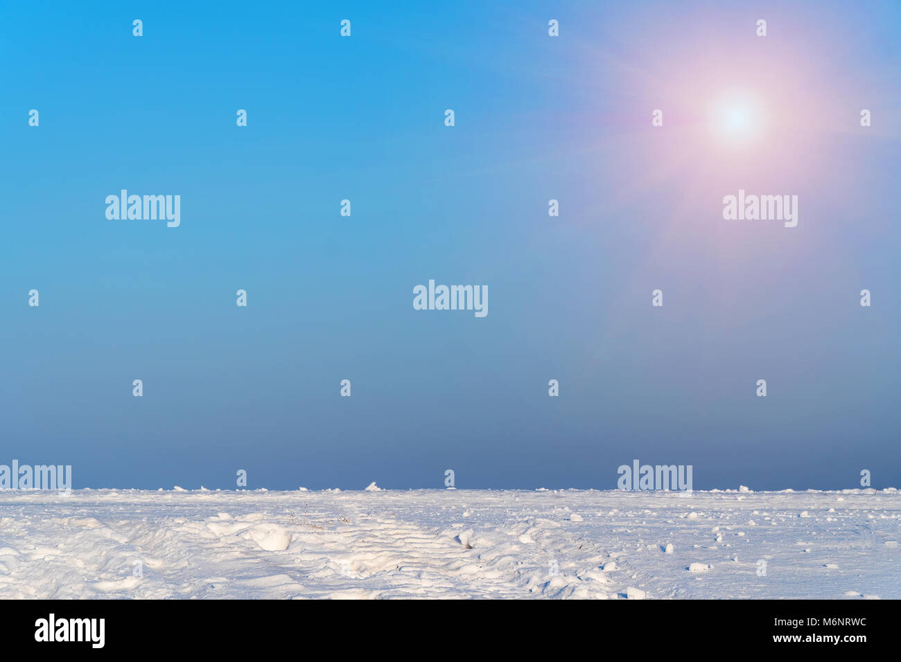 Landscape with blue sky and sun Stock Photo - Alamy