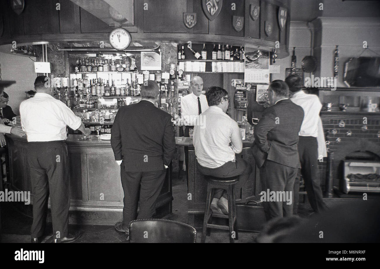 1970s, historical, men drinking and chatting in a proper British boozer ...