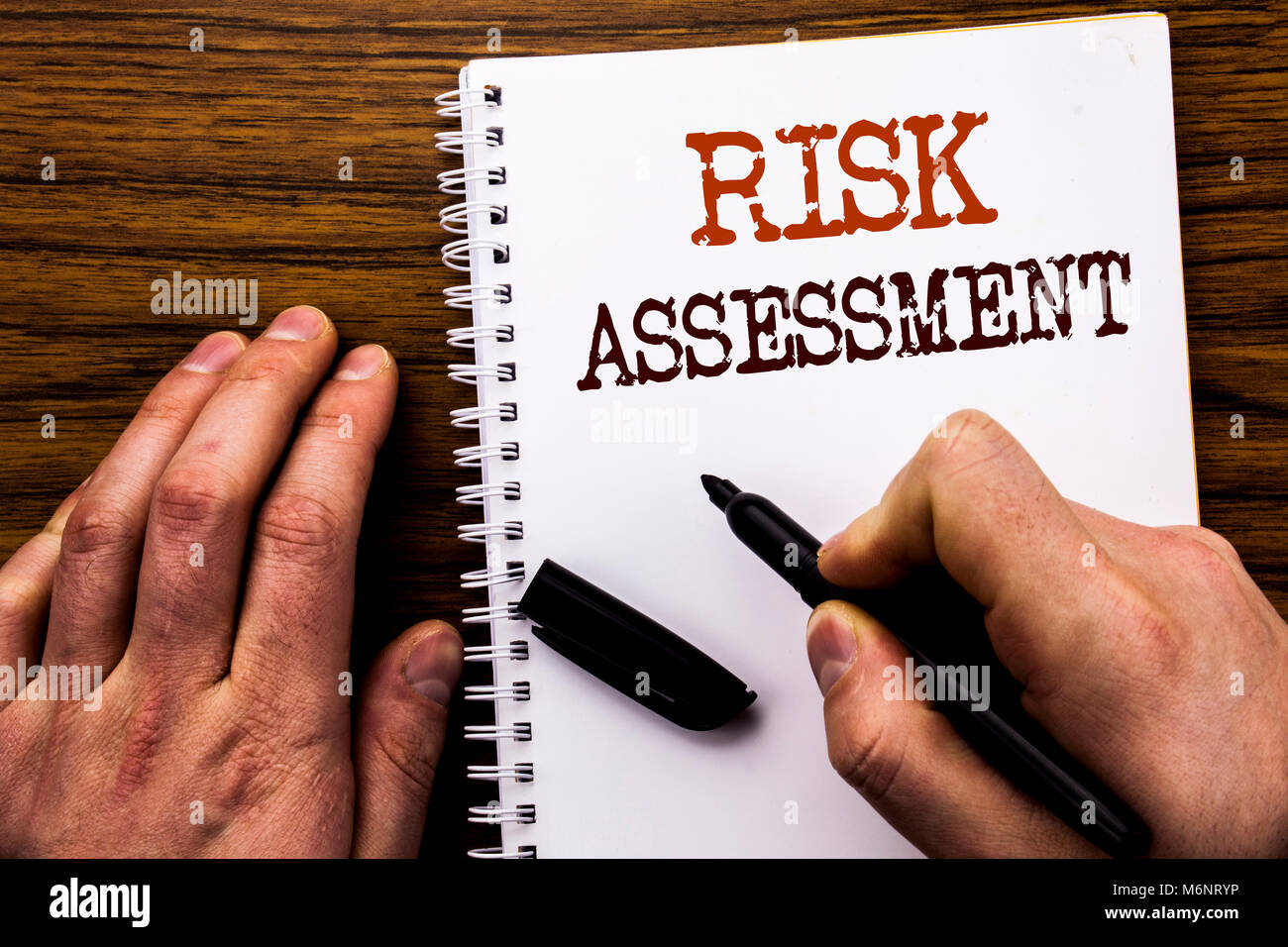 Handwritten text showing word Risk Assessment. Business concept for ...