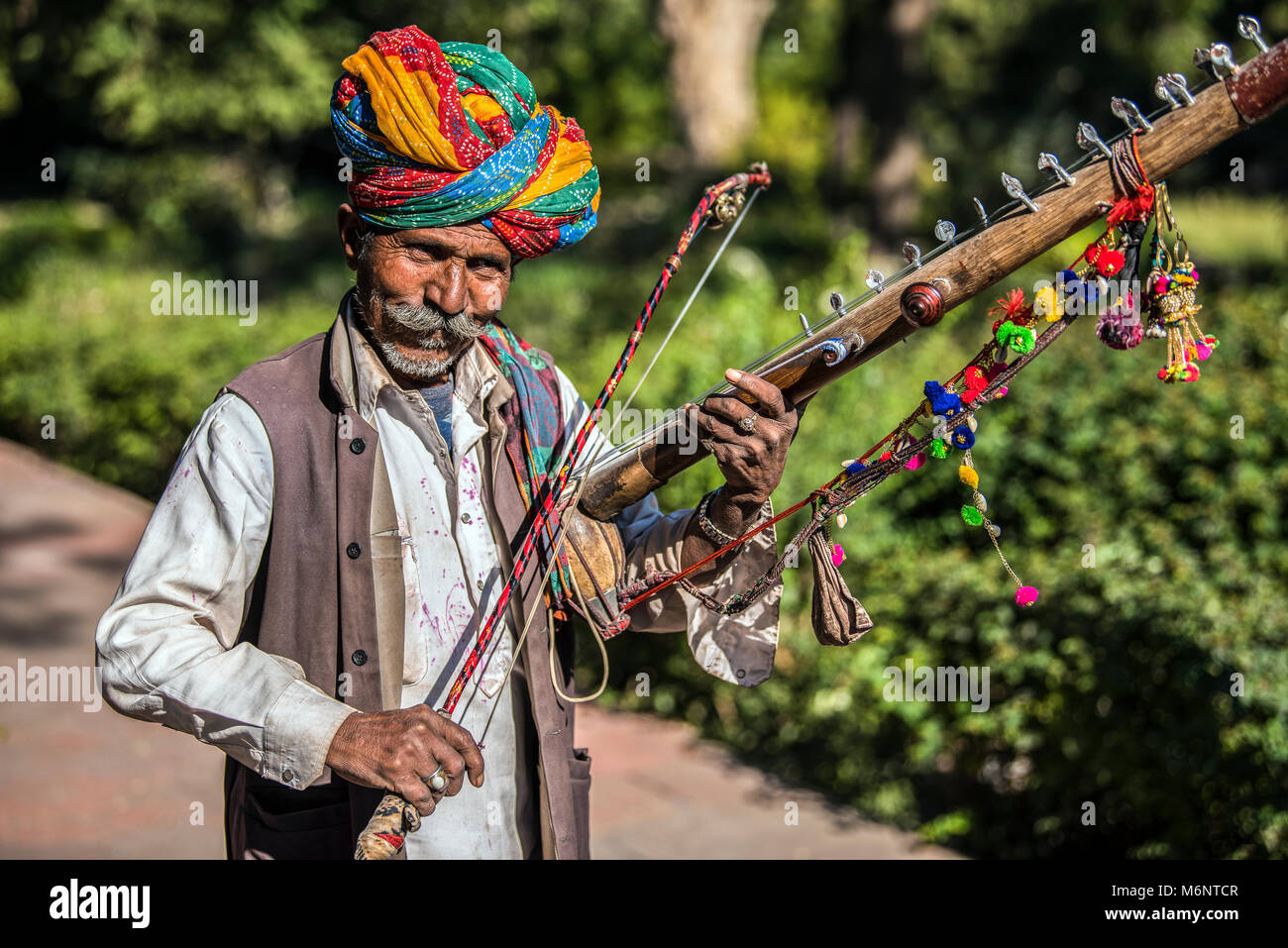 INDIA RAJASTHAN Mandore Garden. Musician playing a traditional ...