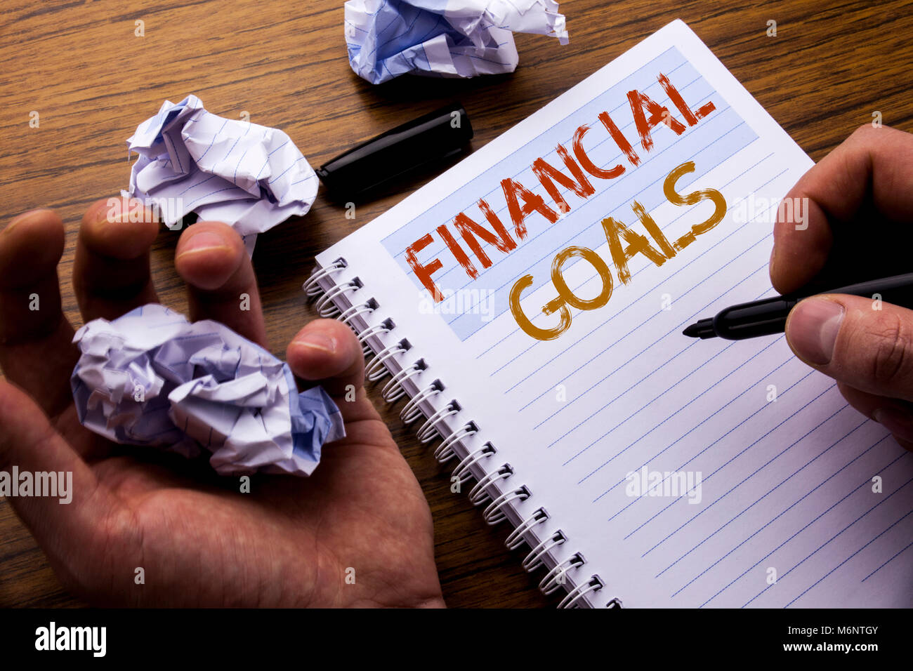 Word, writing Financial Goals. Concept for Income Money Plan written on ...