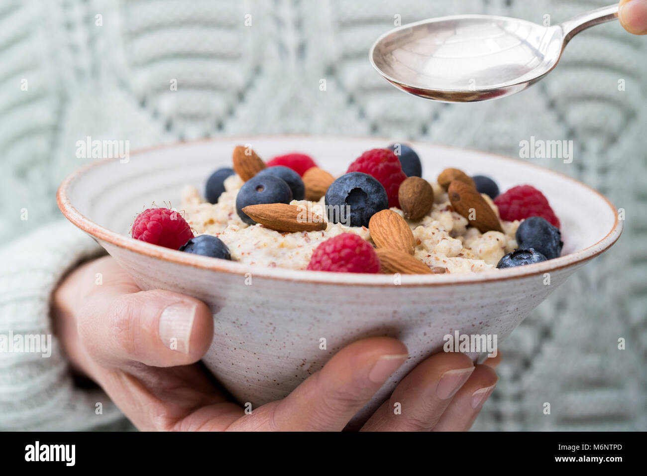 Woman porridge nuts hi-res stock photography and images - Alamy