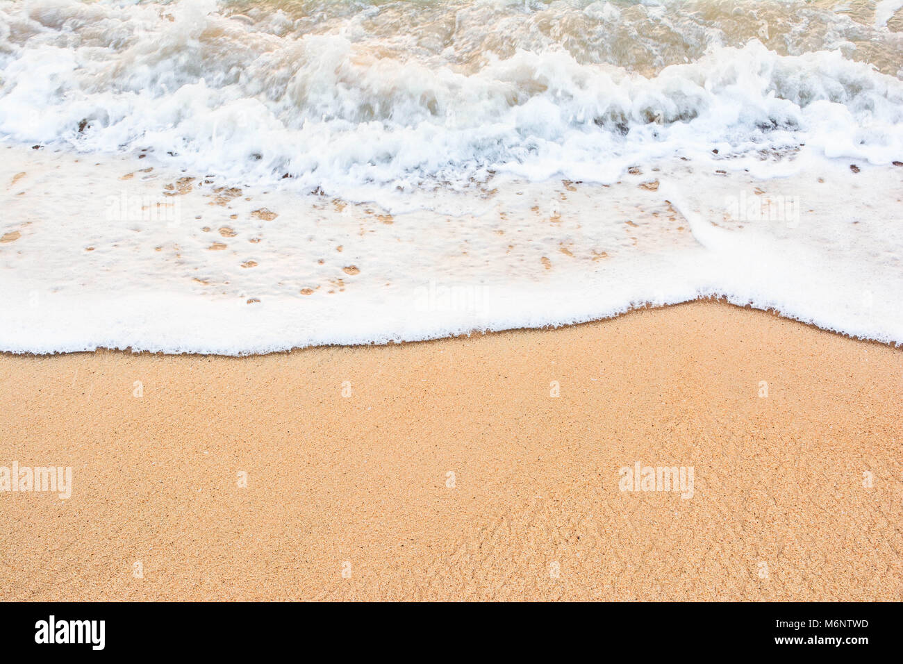 ocean wave on sandy beach Stock Photo - Alamy