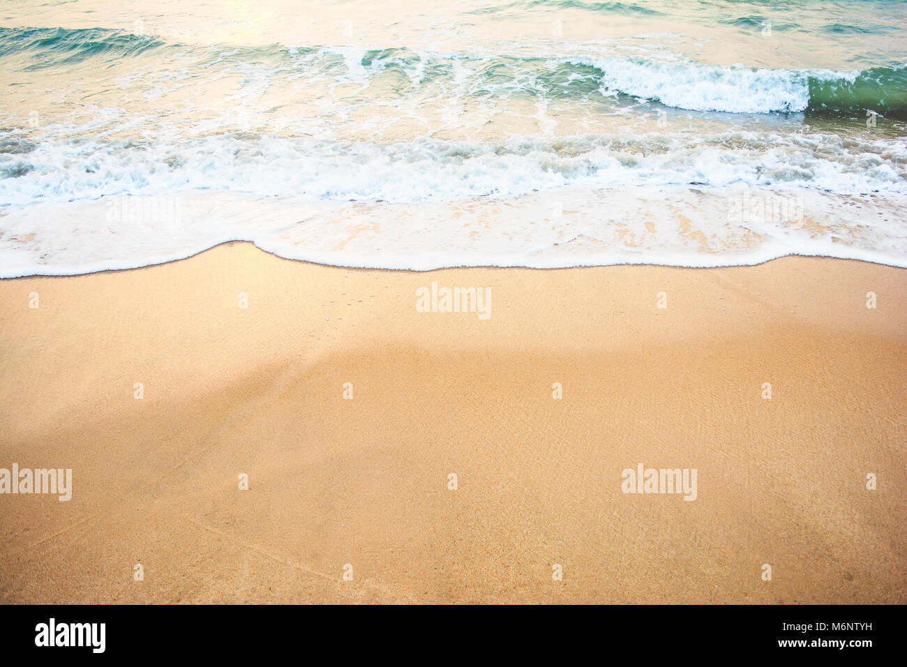 ocean wave on sandy beach Stock Photo - Alamy