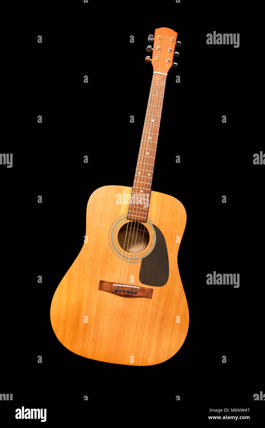 Angled cut out of acoustic guitar on dark background Stock Photo - Alamy