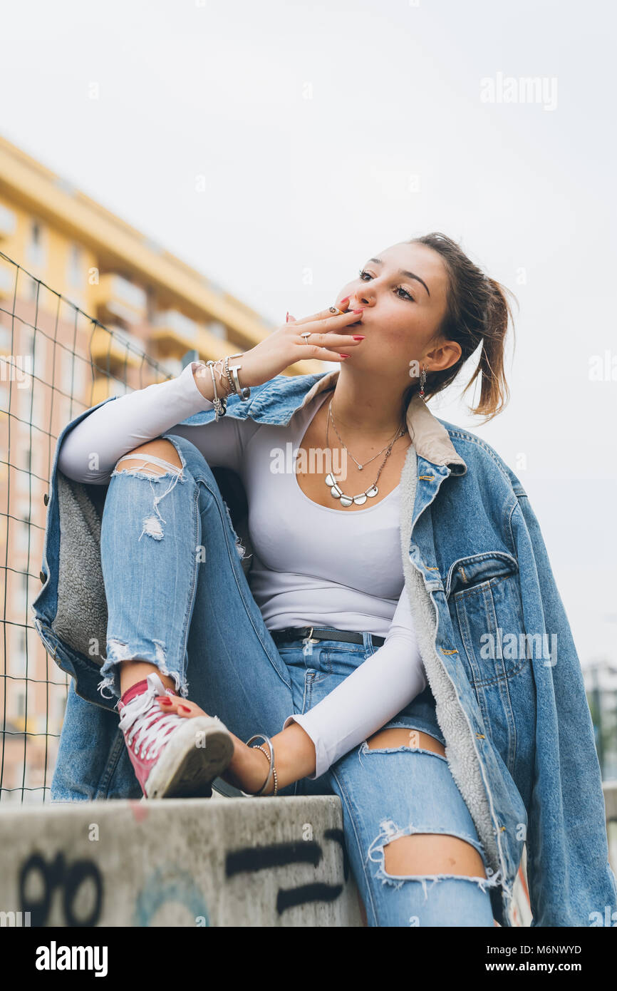 Model Smoking In Jeans
