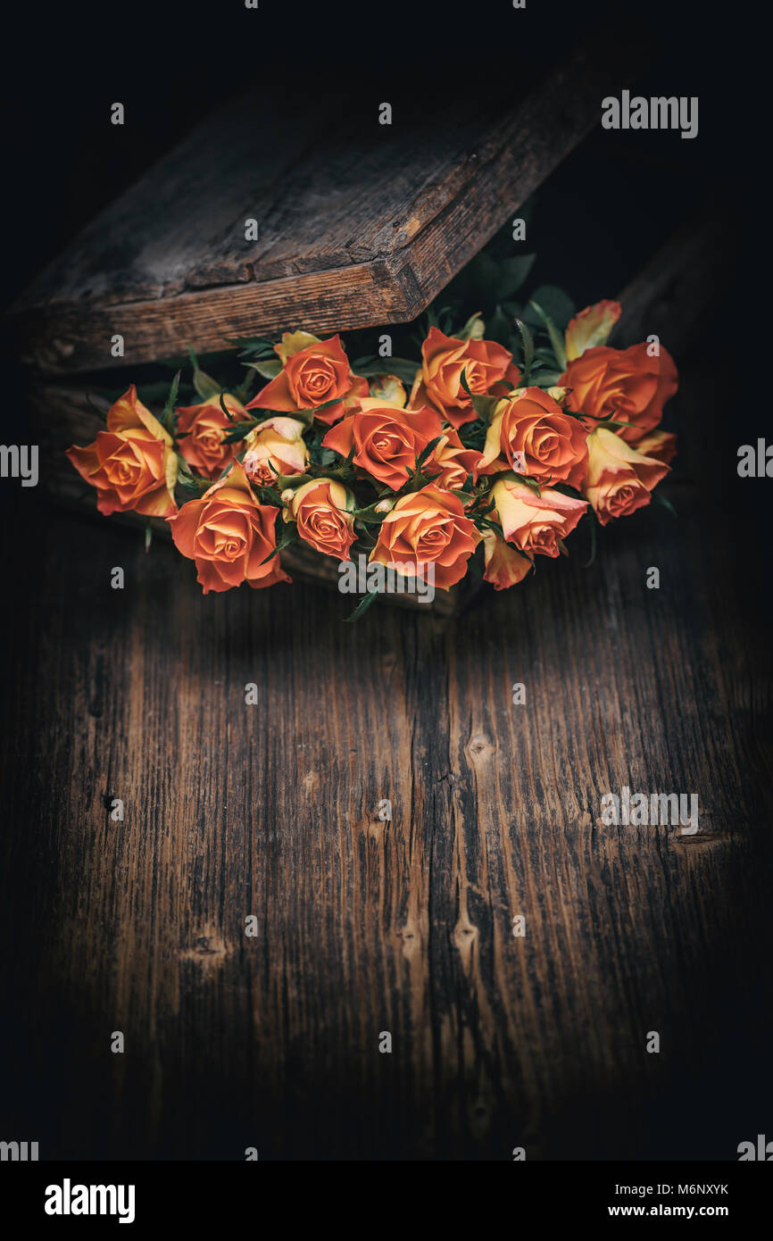 Lovely rose flowers on wooden table, rustic design Stock Photo - Alamy