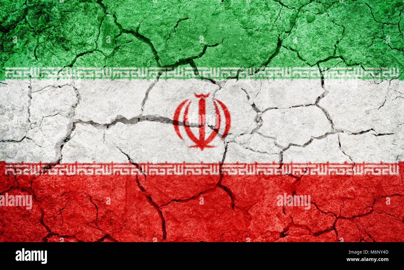 Islamic Republic of Iran flag on dry earth ground texture background ...