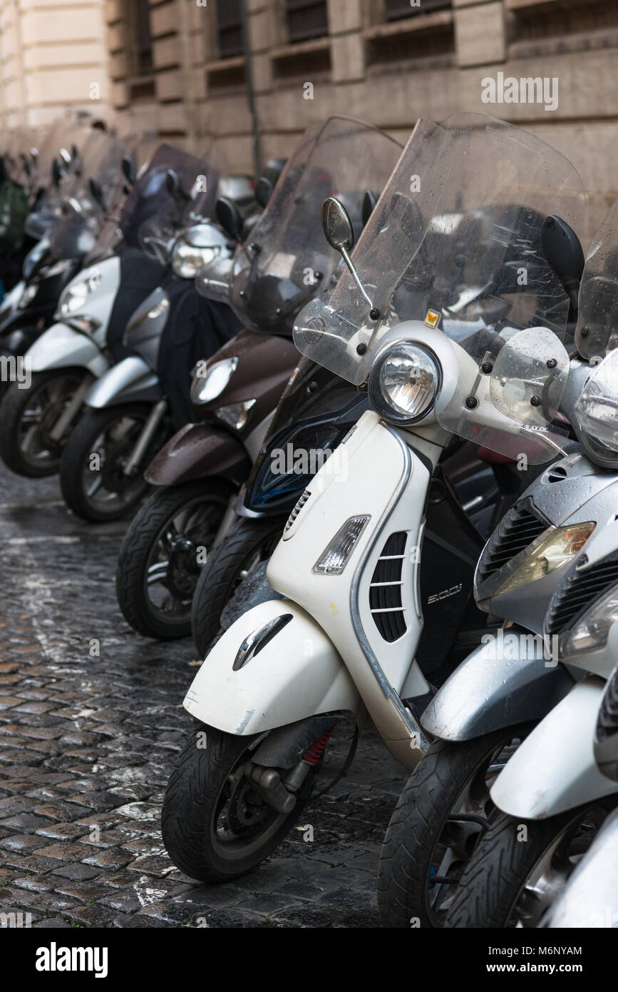 Vespas and other motorcycles on Rome cobbled streets, Lazio, Italy ...