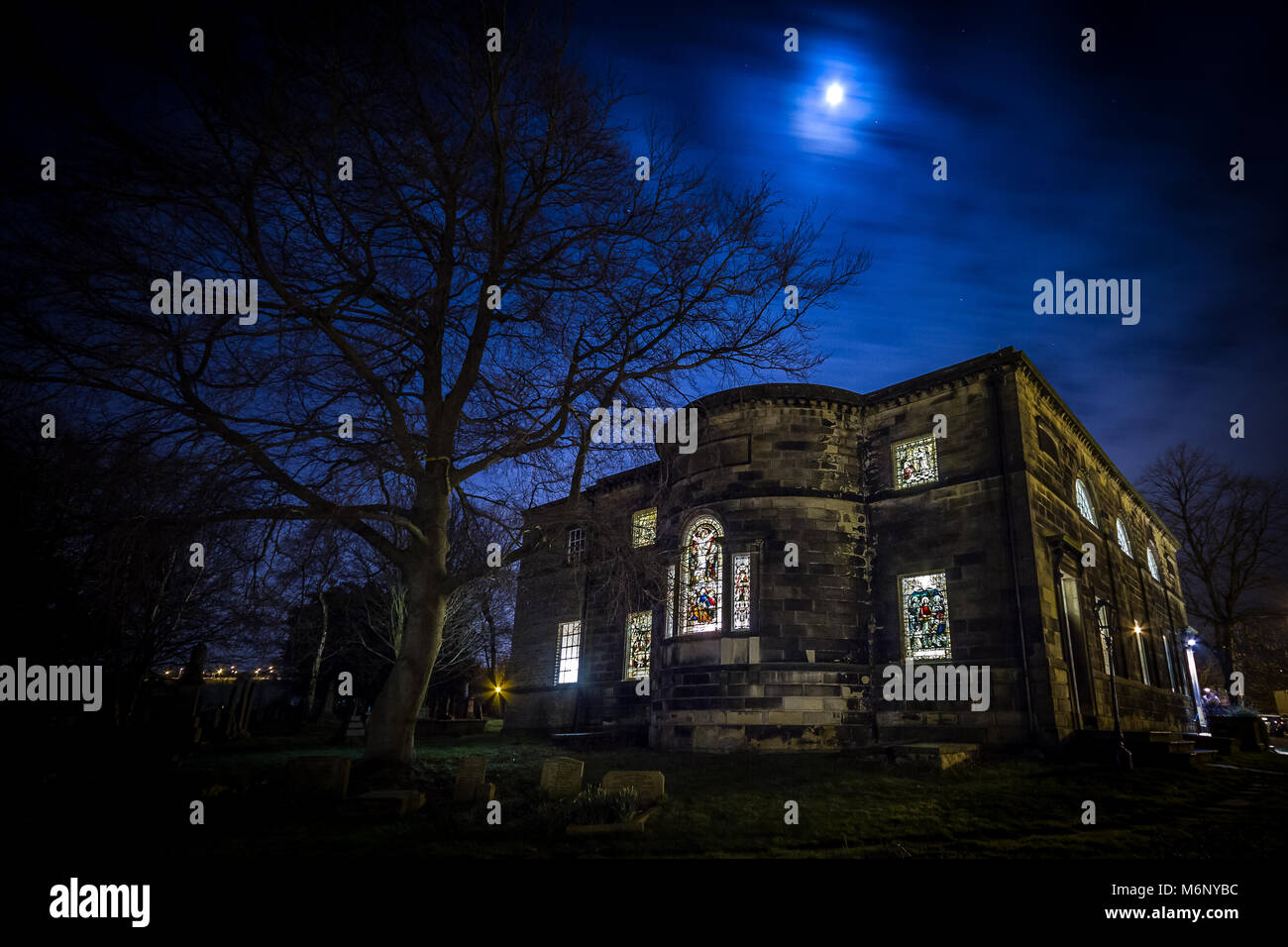 St Matthew's Church Rastrick, with it's lit stained glass windows Stock ...