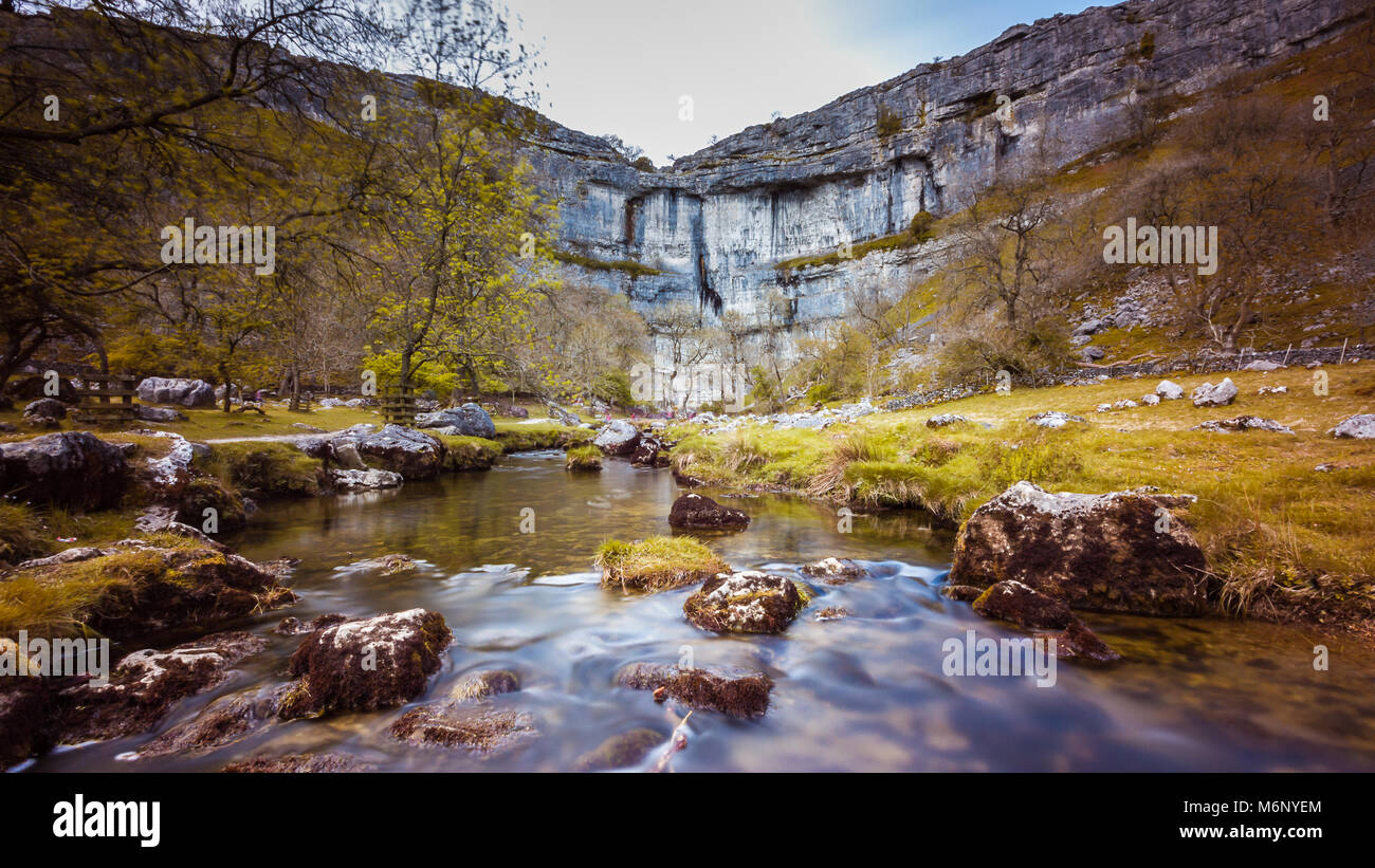 A well-known beauty spot, a large, curved limestone cliff at the head ...