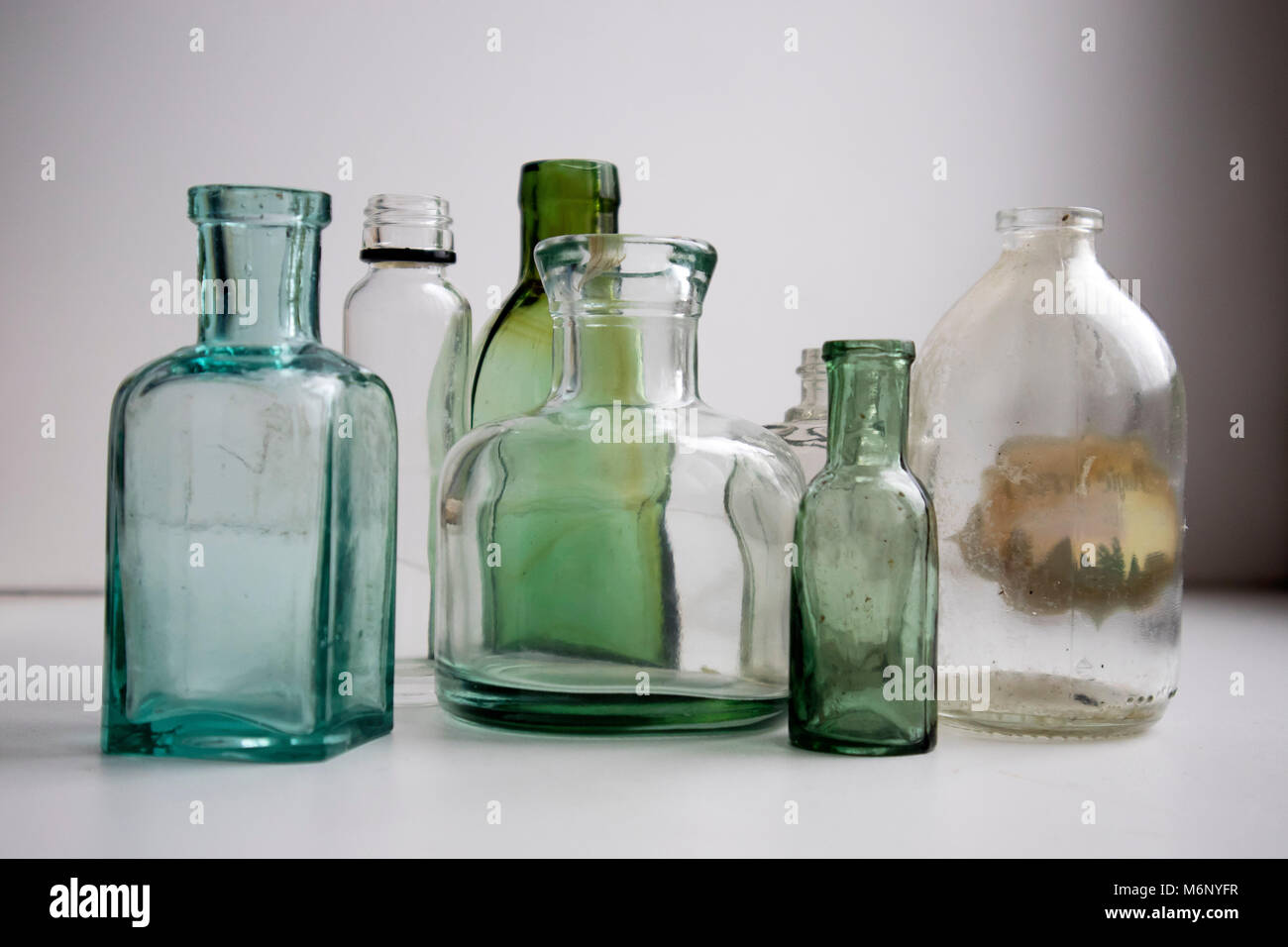 Empty vintage apothecary bottles at the window Stock Photo - Alamy