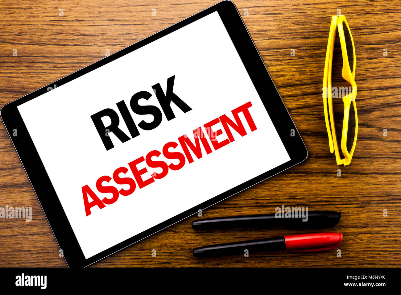 Writing text showing Risk Assessment. Business concept for Safety ...