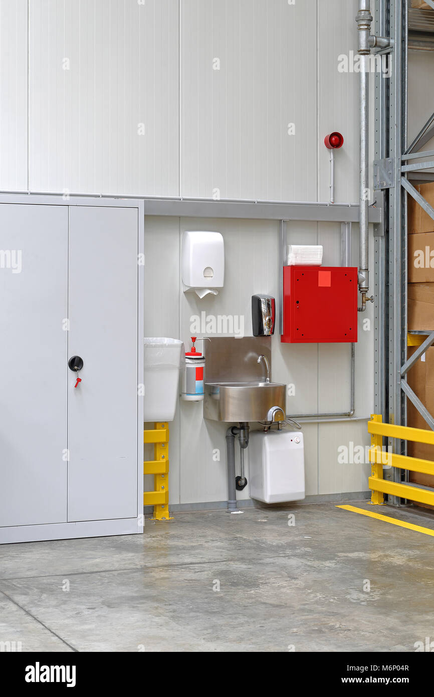 Washing Station Hydrant and Locker in Warehouse Stock Photo - Alamy