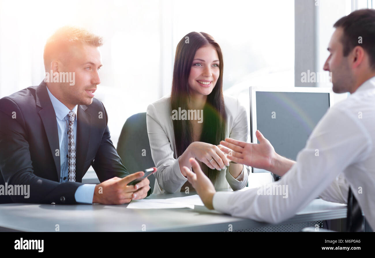 Business team conducts an interview with a young candidate Stock Photo ...