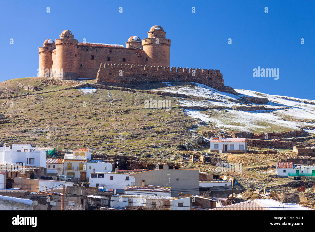 Snow-covered Castle and village of La Calahorra in the Sierra Nevada ...