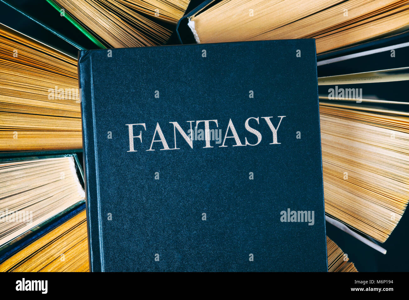 Top view of old hardcover books with book Fantasy on top Stock Photo ...