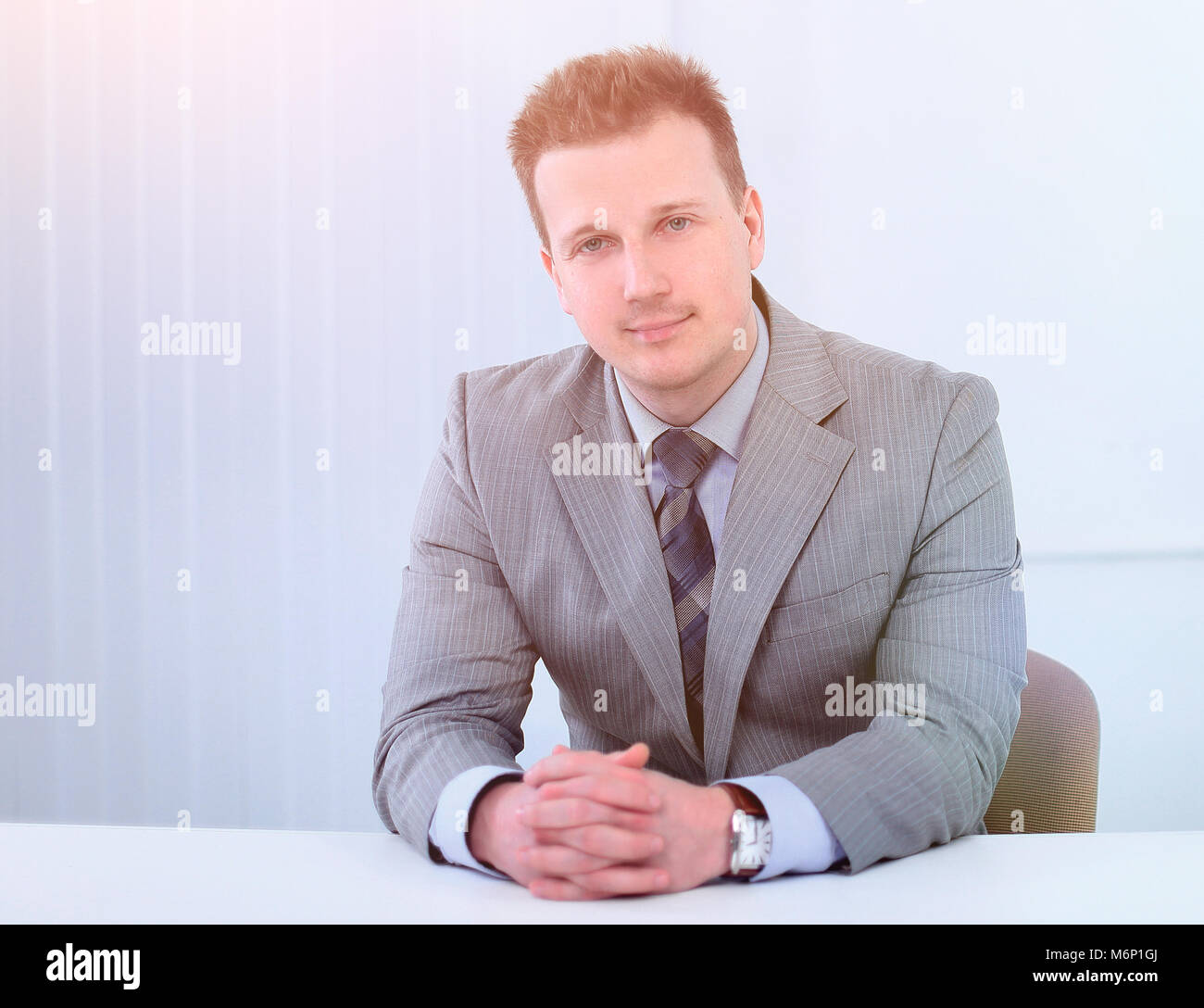 Boss sitting behind desk standing hi-res stock photography and images ...