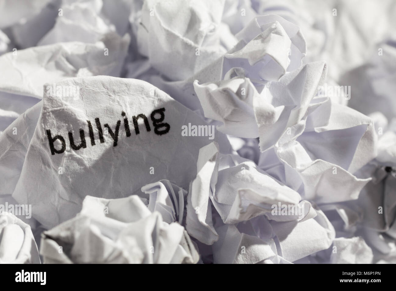 Crumpled paper written bullying. Illustrative concept of ideology ...
