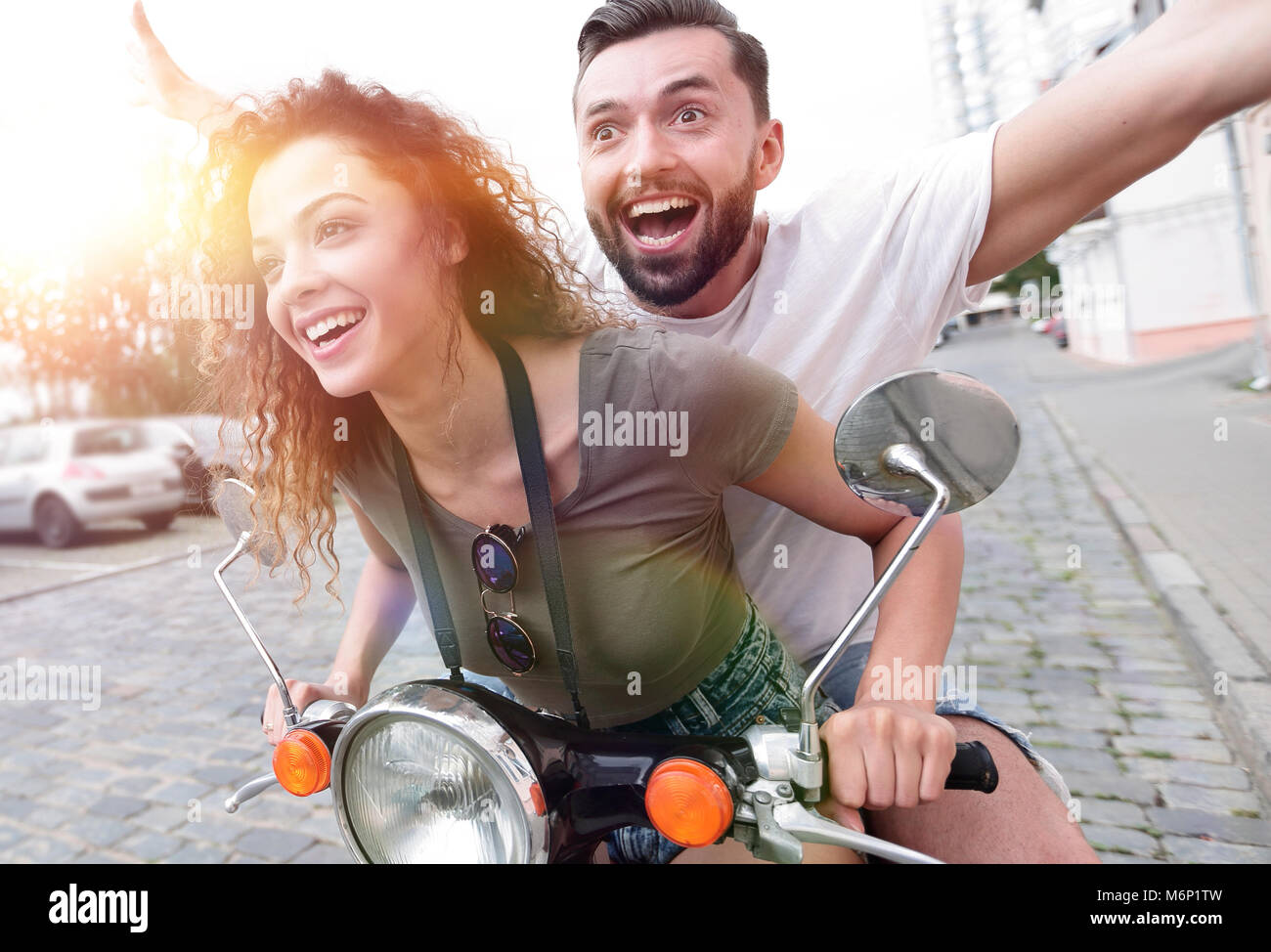 Happy motor scooter rider hi-res stock photography and images - Alamy