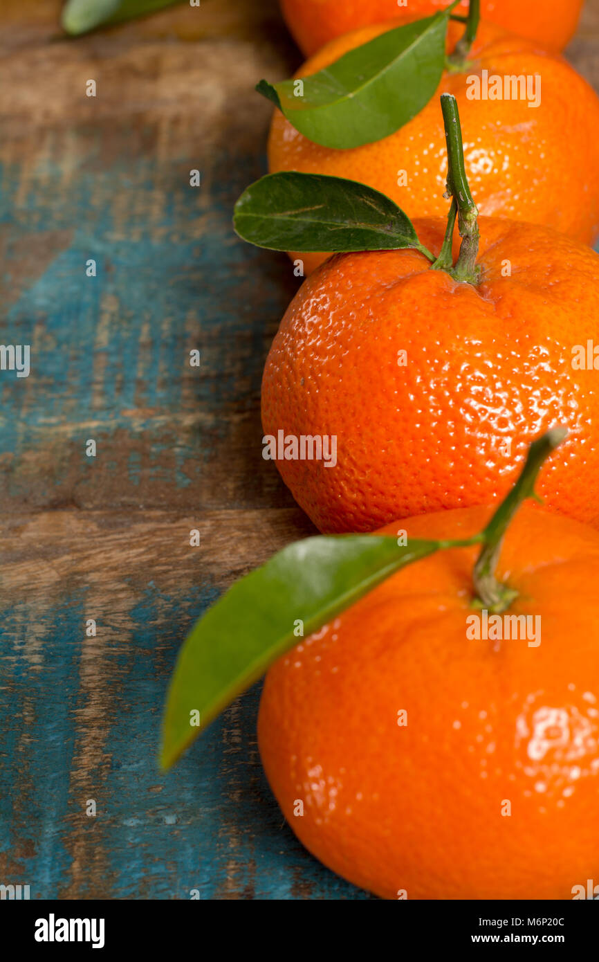 Ripe colorful tropical citrus fruits, mandarins or clementines close up ...