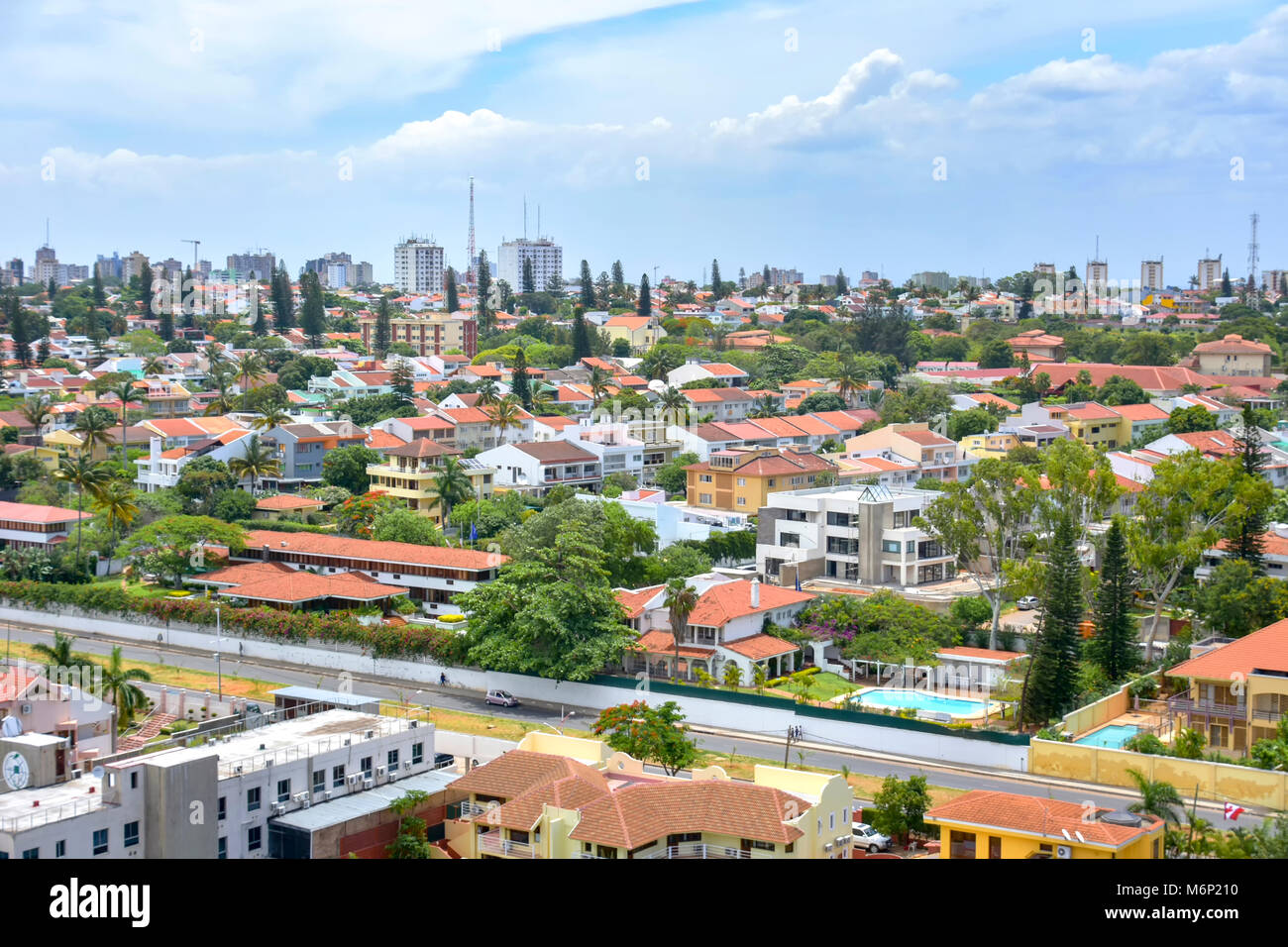 A colorful elevated view of houses in a residential area in Maputo, the ...