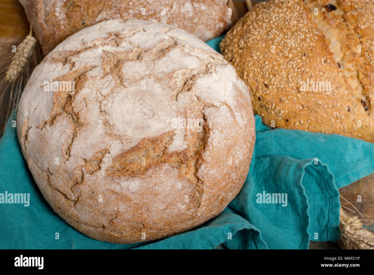 Farmers homemade organic wheat, barley and rye bread in assortment on ...