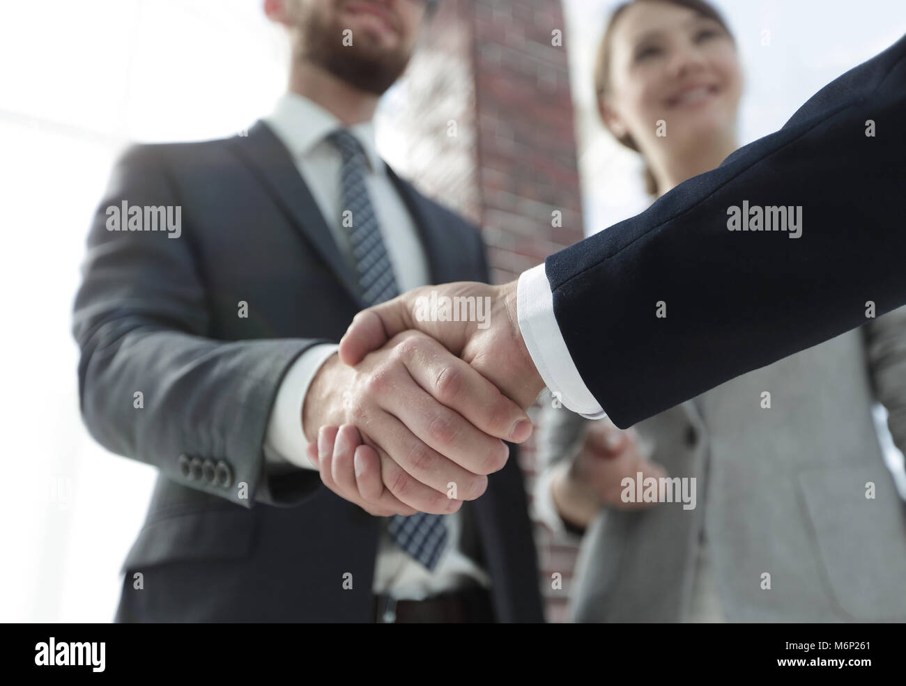 friendly handshake of business people Stock Photo - Alamy