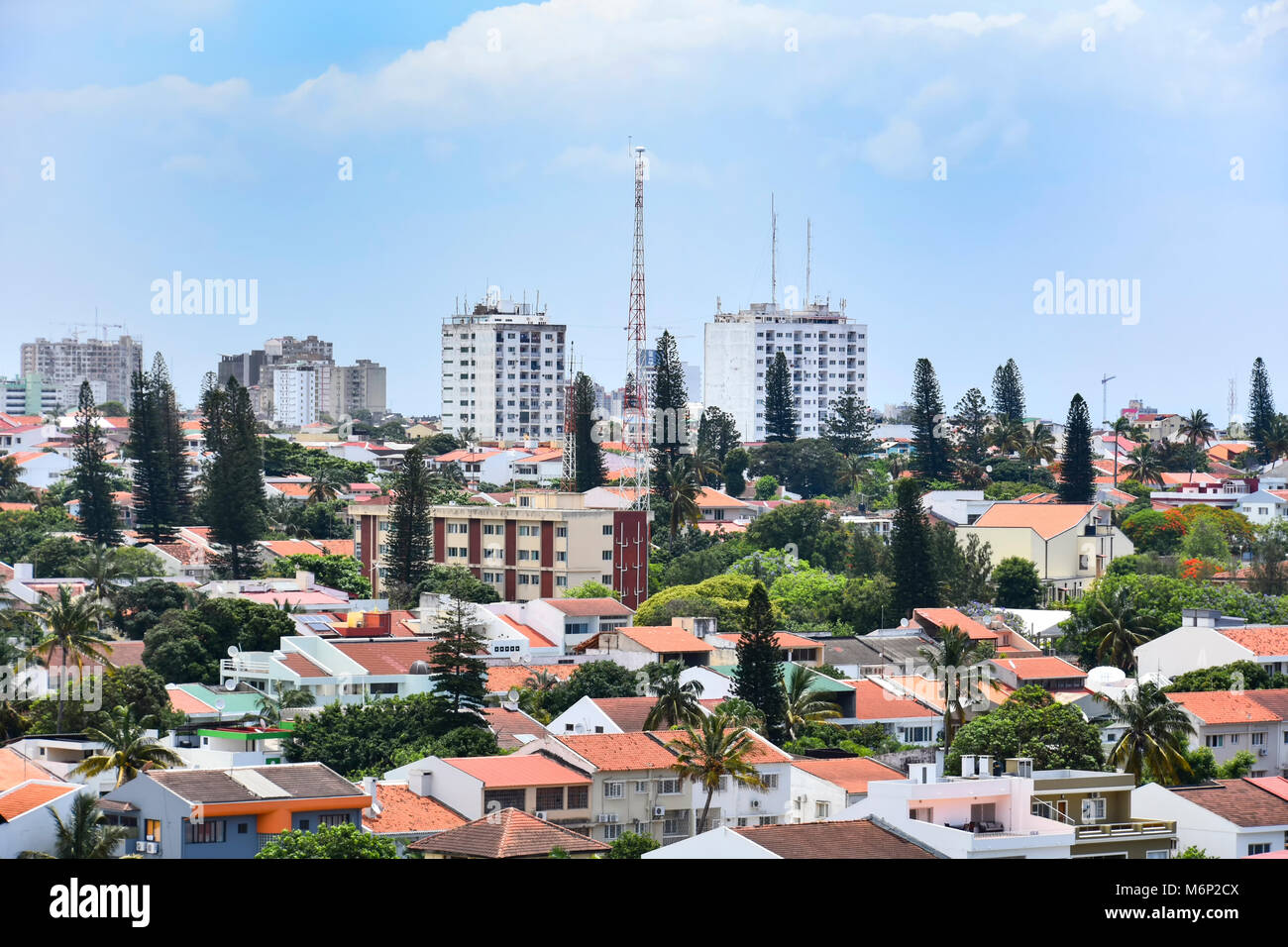 A colorful elevated view of houses in a residential area in Maputo, the ...