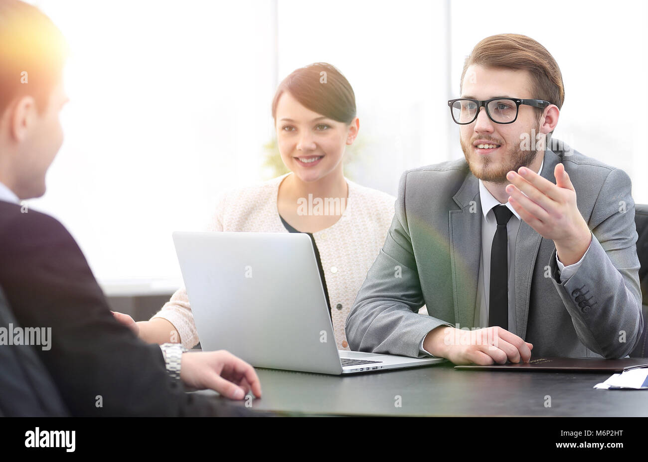 employees communicate with the customer in the office Stock Photo - Alamy