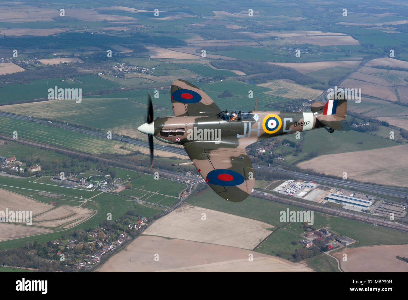 Supermarine Spitfire WWII RAF fighter aircraft flying over the Kent ...