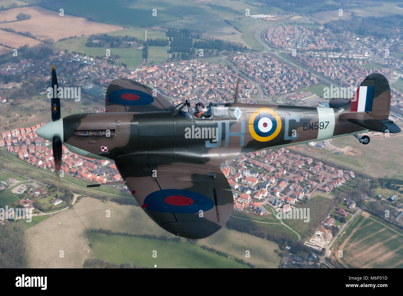 Supermarine Spitfire WWII RAF fighter aircraft flying over the Kent ...