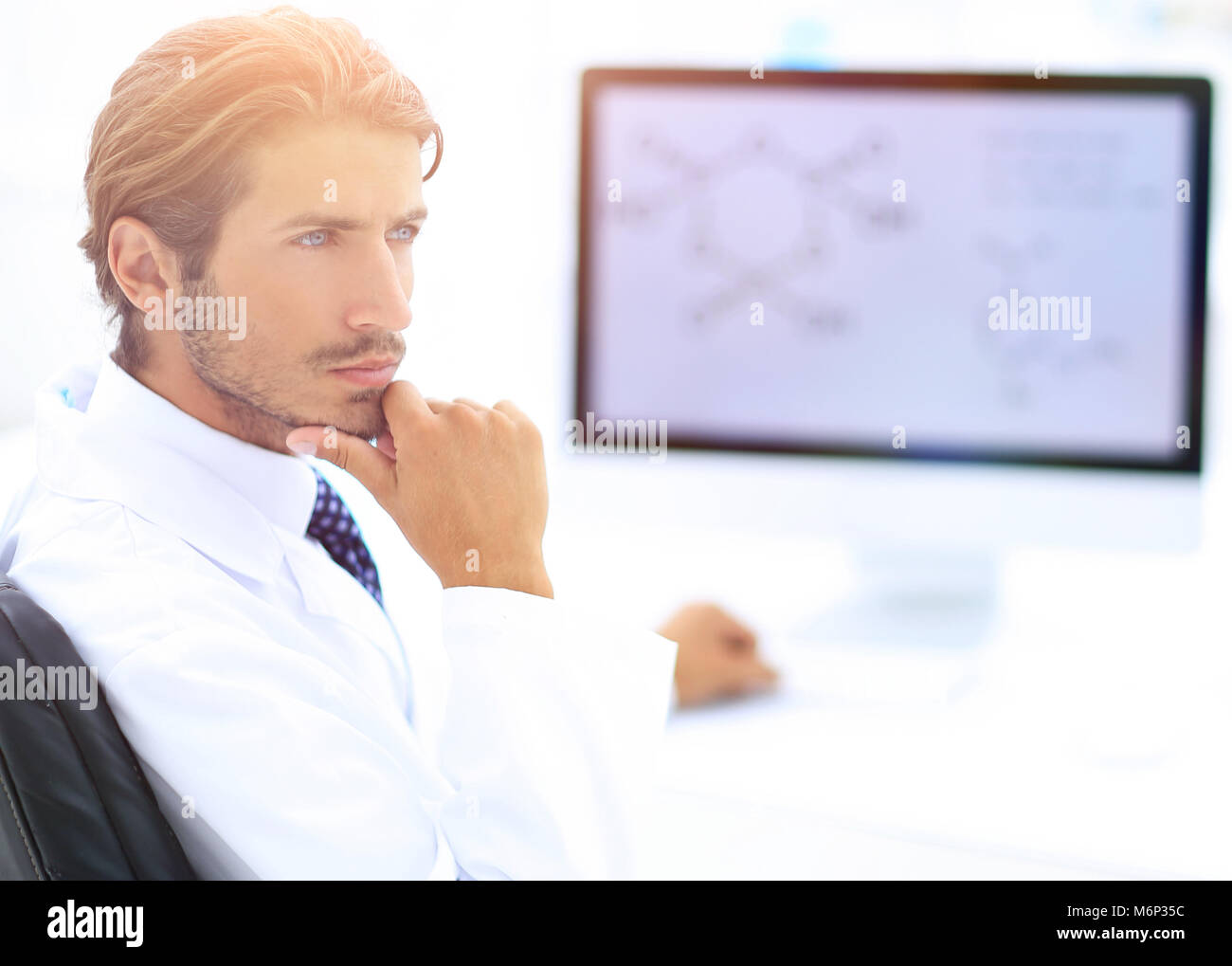 Scientist using computer and microscope in the laboratory Stock Photo ...