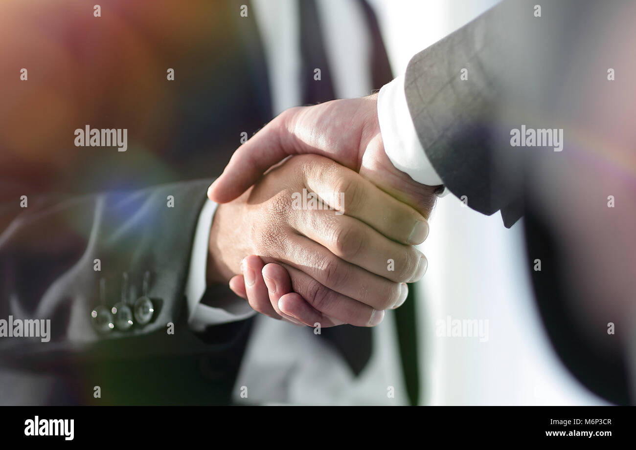 Business men giving a handshake. Business concept Stock Photo - Alamy