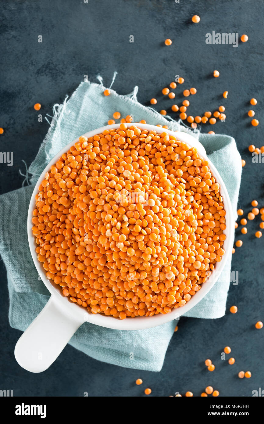 Raw lentil in bowl on table. Fresh lentils. Vegetarian food. Top view ...