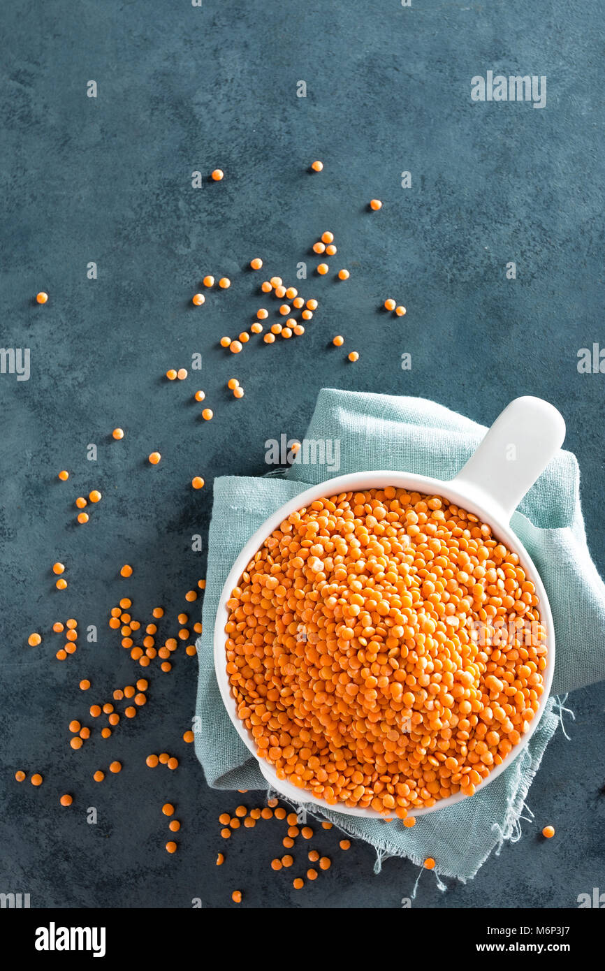 Raw lentil in bowl on table. Fresh lentils. Vegetarian food. Top view ...