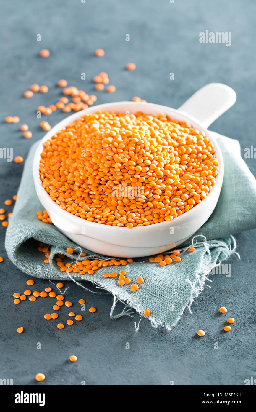 Raw lentil in bowl on table. Fresh lentils. Vegetarian food Stock Photo ...