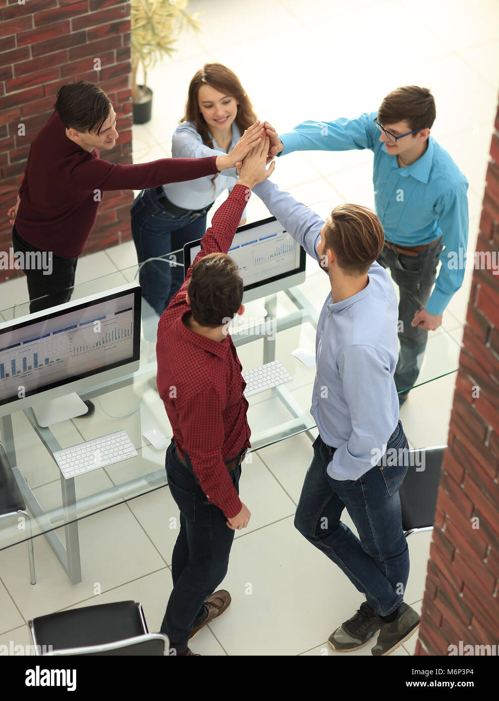 Business people happy showing team work and giving five in offic Stock ...