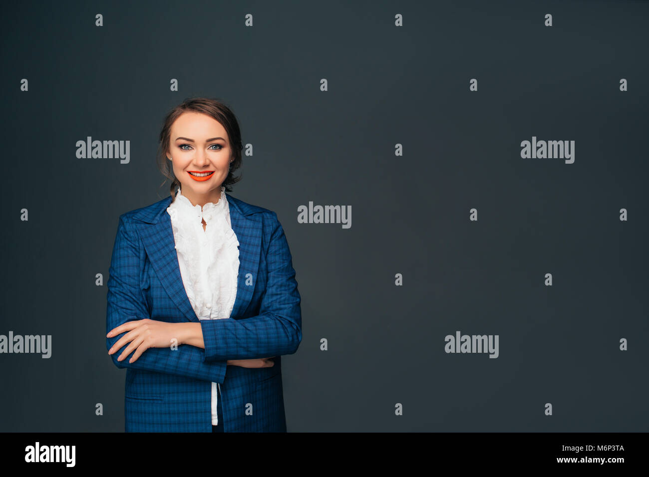 Portrait confident business woman on gray Stock Photo - Alamy