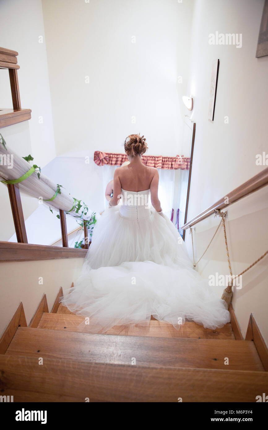 Bride walking down the stairs Stock Photo - Alamy