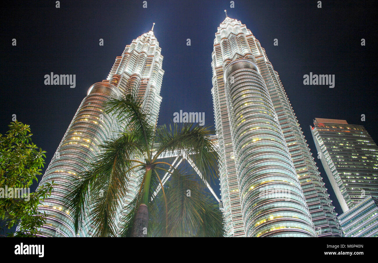 Cityscape scene at night of Petronas Towers, Kuala Lumpur City Centre ...