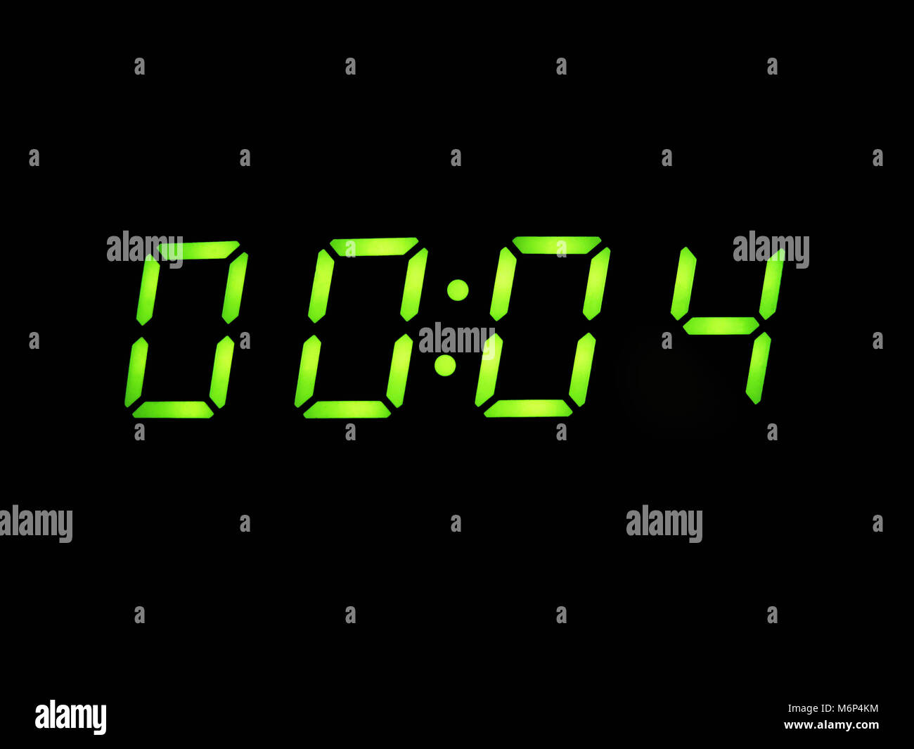 digital alarm clock with green digits Stock Photo - Alamy